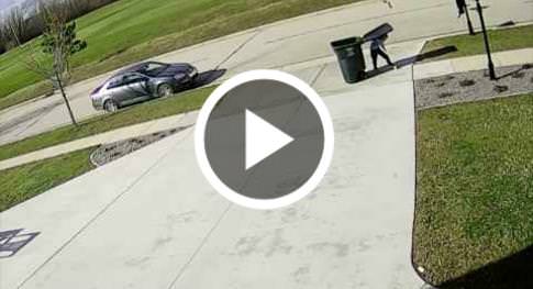 Kid Versus Garbage Can On A Windy Day